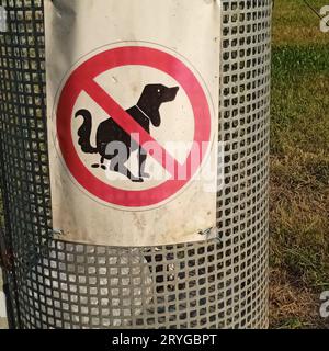 Dog feces sign in the park Stock Photo - Alamy