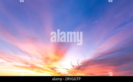 Wild, fiery evening sky with clouds just before sunset Stock Photo - Alamy