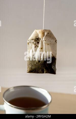 green tea, dried leaves with filter, on wooden background, vintage ...