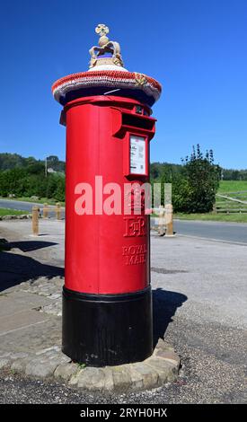 A free-standing letter box with a knitted top at Bolton Abbey, North ...