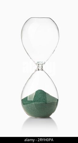 Hourglasses with green sand Stock Photo - Alamy