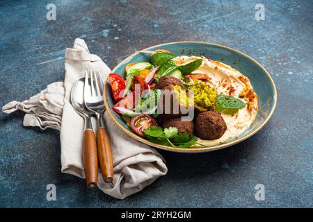 Close up of Middle Eastern Arab meal with fried falafel, hummus ...