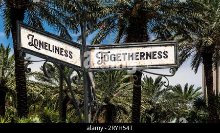 Street Sign Togetherness versus Loneliness Stock Photo - Alamy