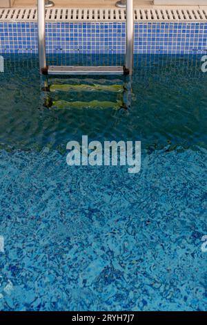 Swimming pool and ladder on a hotel appartment. Luxury vacations ...