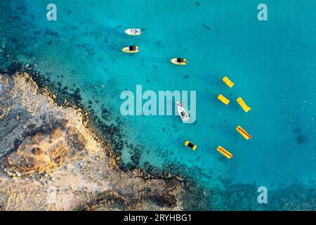 Aerial drone photograph watersport boat at fig tree bay beach cyprus ...