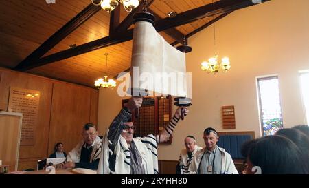 The Hagbahah (lifting of the Sefer Torah) ceremony when a congregant is ...