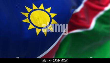 Close-up view of the Namibia national flag waving. Blue stripes, yellow ...