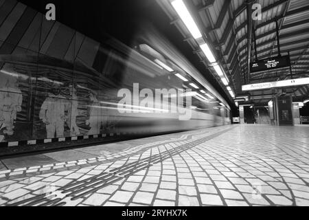 A greyscale long shutter speed shot of an empty metro station in ...