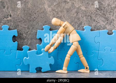 Dummy building blue puzzle. Creating or building own business concept ...