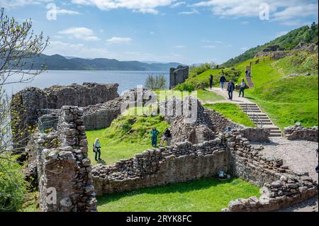 Urquhart Castle with tourist walking around, Loch ness lake in the ...