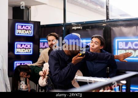 Angry security officer holding a walkie talkie and gestruing stop ...