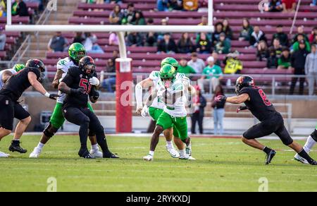 Oregon running back Bucky Irving (0) is tackled by Stanford cornerback ...