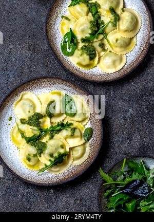 Italian spinach ricotta ravioli, Top view, black background, copy space ...