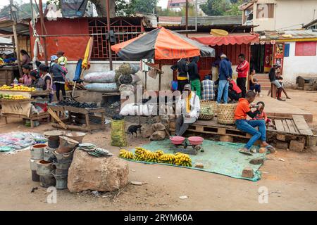 Street fruit vendors sell their goods by the roadside in Antananarivo ...