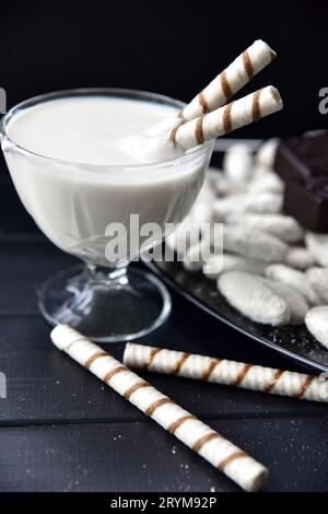 sweets, straws in the cream,cookies and candies on the table Stock ...