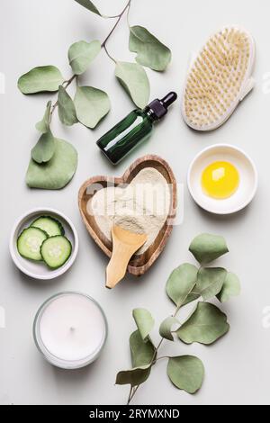 Cosmetic skin care products with eucalyptus on green background. Flat ...