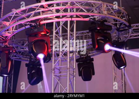 LED moving heads hanging on a box truss structure. Professional stage ...