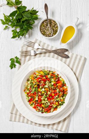 Israeli salad of finely diced tomato, onion, cucumber, and bell peppers ...