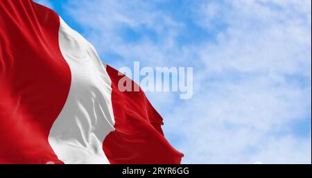 Close-up view of the Peru national flag waving in the wind. The ...