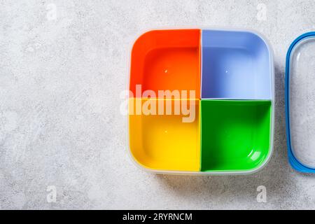 Empty lunch box with four sections for different food Stock Photo - Alamy