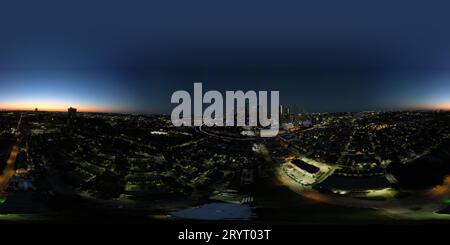 An aerial view of the vibrant Houston skyline at night with illuminated ...