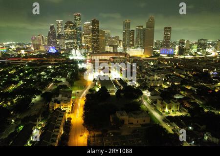 An aerial view of the vibrant Houston skyline at night with illuminated ...