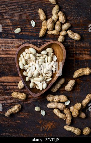 Salted peanuts on dark background. Peanuts in a coconut bowl. Studio ...
