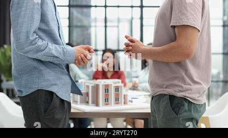 Architect explaining project plan to clients. Confident businesswoman ...