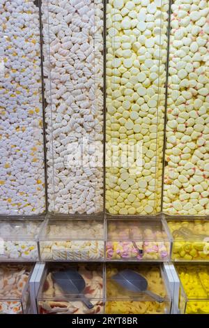 showcase of candy shop, transparent container with sweets, candy and ...