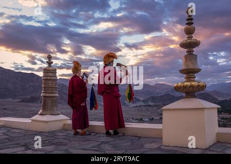 Buddhist monks blowing conch shells at Thikse Monastery (Thiksay Gompa ...