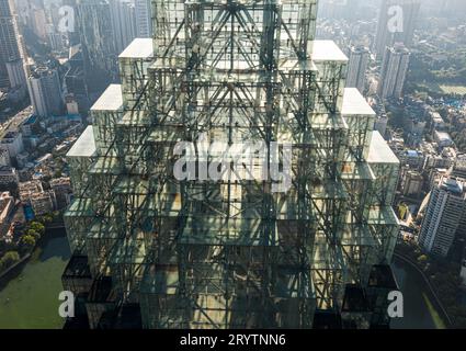 A view of the pyramid-shaped dome of a modern, sky-scraping building ...