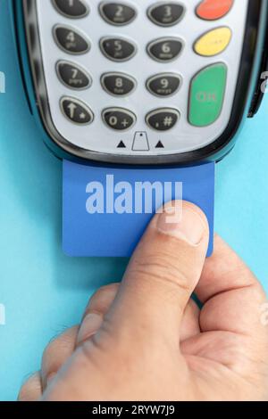 Hand put Credit card into payment terminal on white background Stock ...