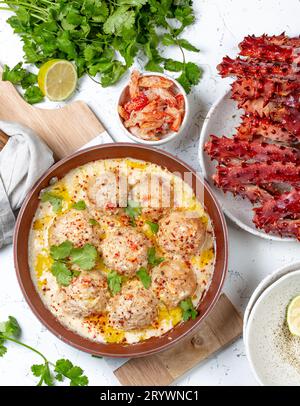 CRABMEATBALLS crab meatballs in white creamy sauce in red pan, whole ...
