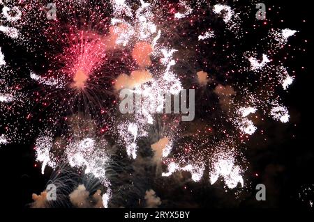 colorful explosions of huge fireworks during the festivities at night ...