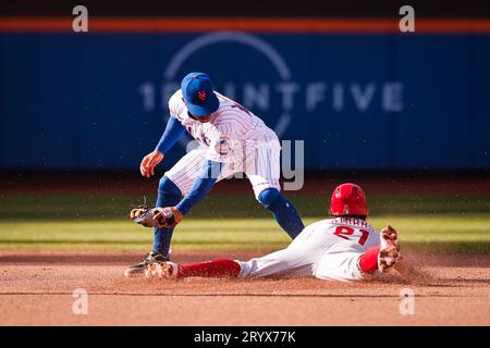 Philadelphia Phillies catcher Garrett Stubbs, center, signs a fan's ...