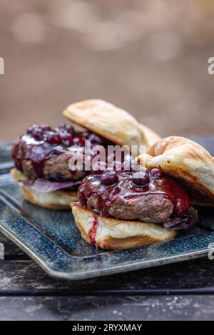 Fresh grilled beef burgers topped with a huckleberry bbq sauce and ...
