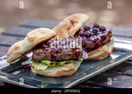 Fresh grilled beef burgers topped with a huckleberry bbq sauce and ...