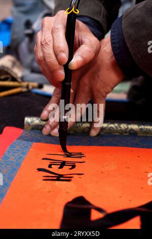 Close to the Temple of Literature, calligraphers show their skills ...