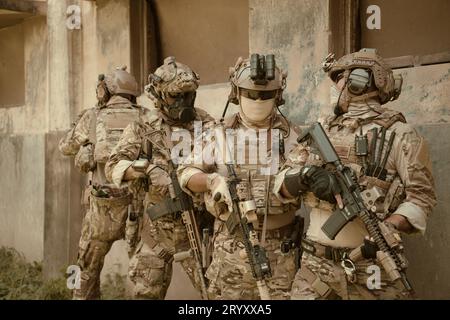 Professional marine soldiers training with weapon on a military range ...