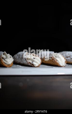 Photo of cannoli, Italian desserts originally from Sicily. Has a hard ...