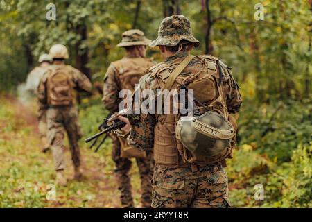 Modern warfare Soldiers Squad Running as Team in Battle Formation Stock ...