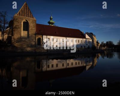 Dominican Monastery reflecting in Malse River at twilight, Ceske ...