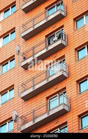 Residential orange colored high rise apartment block in Tirana, Albania ...