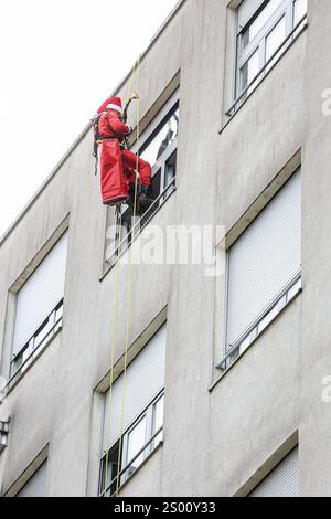 Zagreb, Zagreb. 23rd Dec, 2024. People dressed as Santa Claus rappel ...