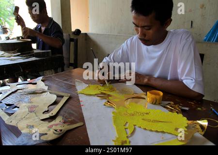 Process of making Wayang Kulit, shadow puppet, a traditional art from ...