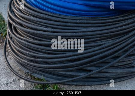 A roll of black electrical cable, close up Stock Photo - Alamy