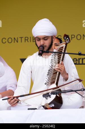 Sikh musician performing on the dilruba at the Vaisakhi Festival in ...