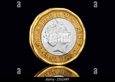 The obverse (front) of a counterfeit UK 12 sided bimetallic £1 coin ...