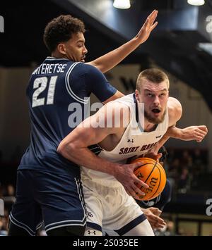 Utah State center Aubin Gateretse (21) shoots as Air Force guard Chase ...