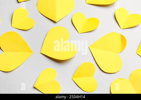 Yellow paper hearts on grey background. Valentine's Day celebration ...